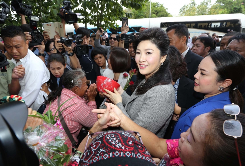 Yingluck urges govt to drop administrative order for damages