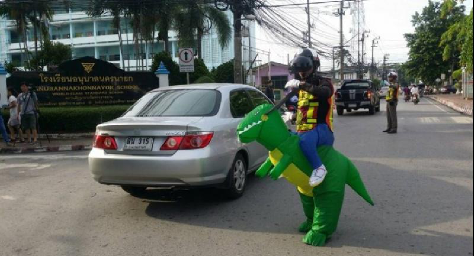 Doyouthinkhesaurus: Thai 'T-Rex' cop gives traffic safety lessons