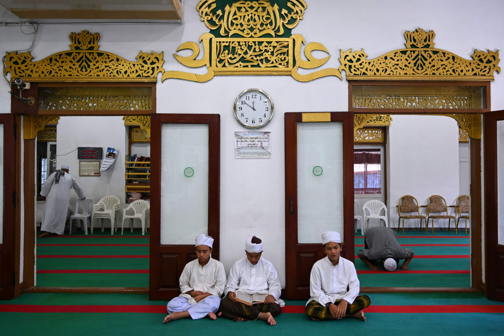 By a thread: Thai Muslim family keeps silk weaving heritage alive