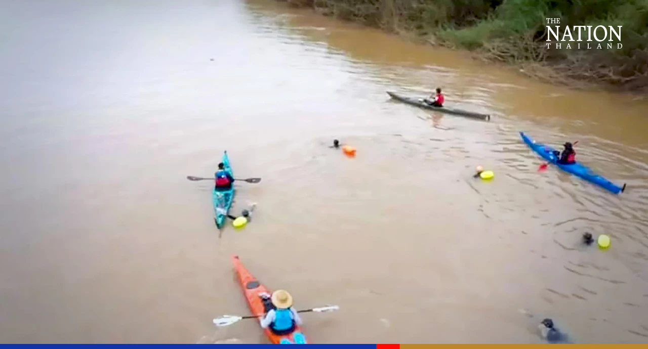 Tono battles currents and critics to complete first half of Mekong swim