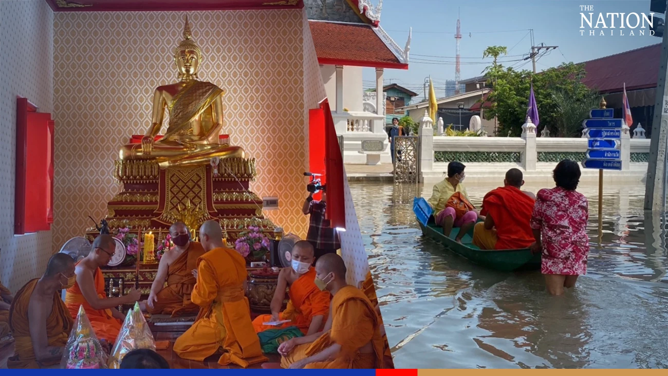 Inundation in Nonthaburi does not stop pious Buddhist man from donning ...