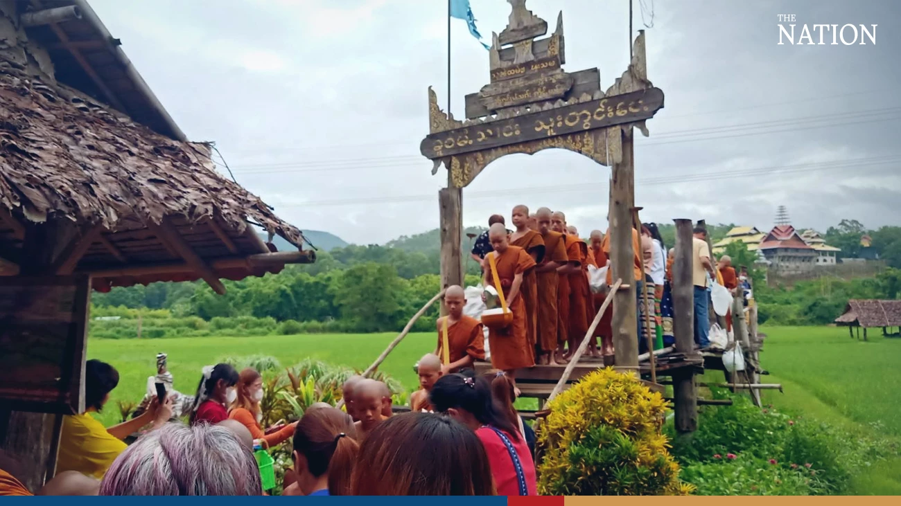 Mae Hong Son bamboo bridge holds strong as devotees give alms to mark ...